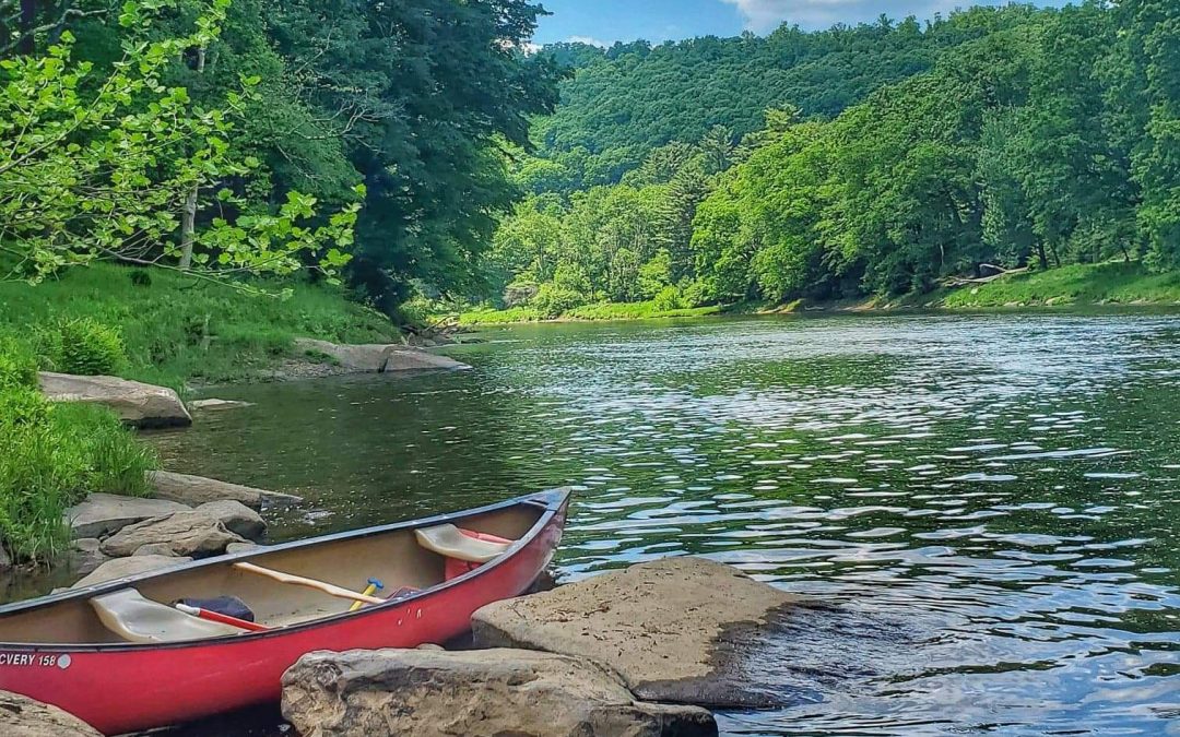 Clarion River canoe on bank by Penny Kay | Visit PA Great Outdoors