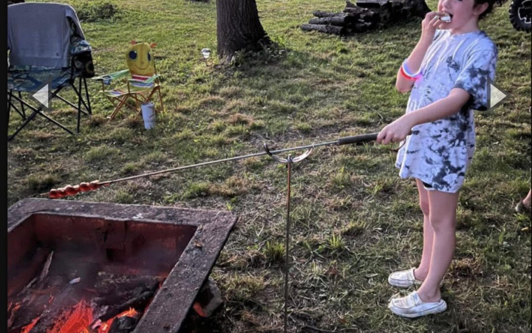 girl eating smore campfire creation | Visit PA Great Outdoors